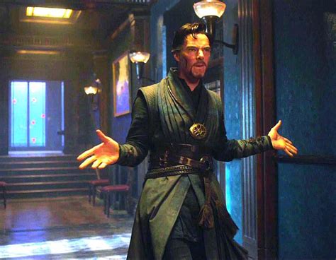 A Man With His Hands Out Standing In Front Of A Doorway And Looking At