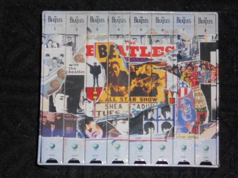 The Beatles Album Covers Are Stacked On Top Of Each Other