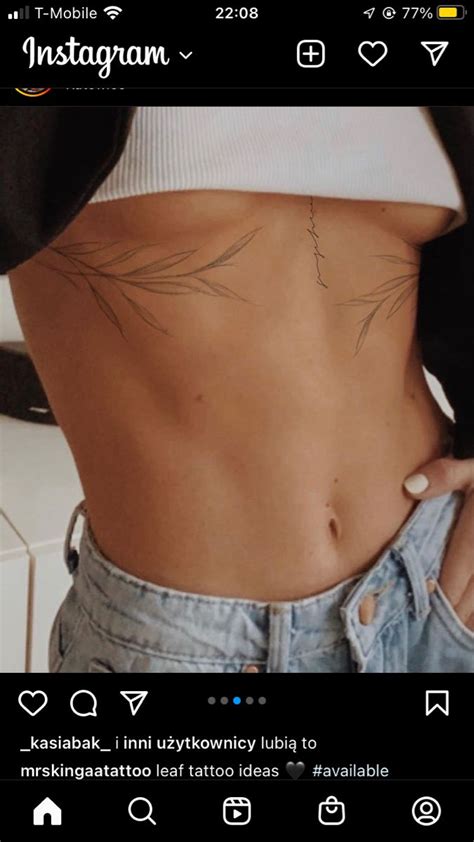 The Back Of A Woman With Tattoos On Her Stomach