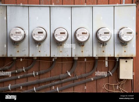 Row Of Electricity Meters On The Side Of An Apartment Block Split House