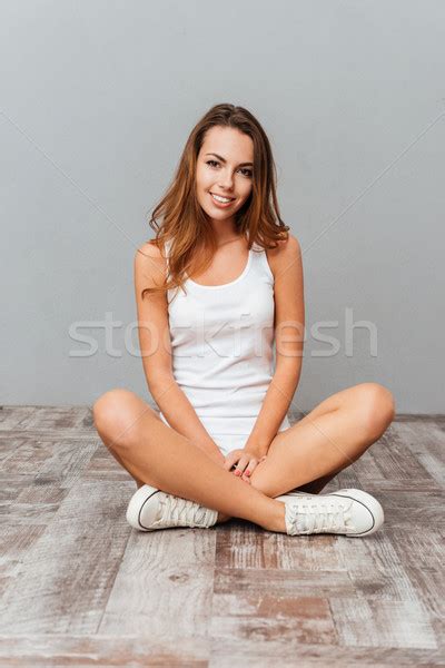 Woman Sitting With Legs Crossed