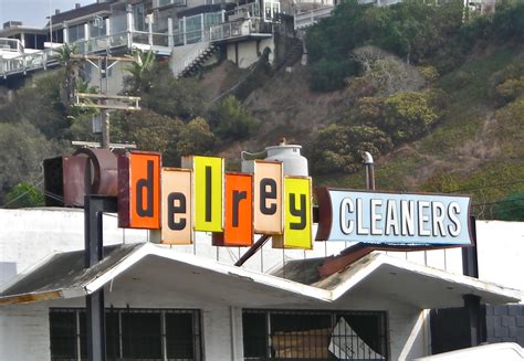 There Are Many Signs On The Roof Of This Building That Say Derby Cleaner S