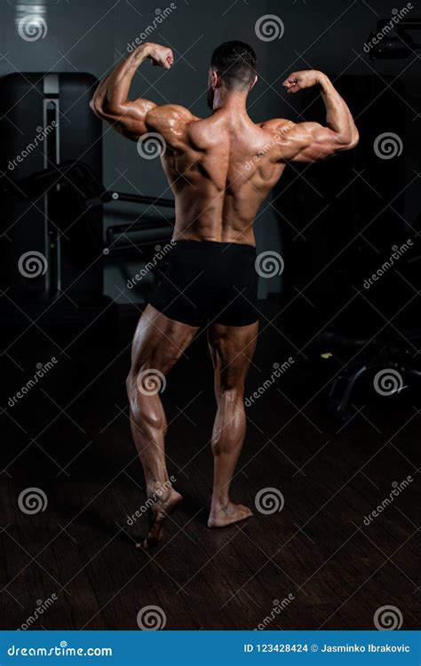 Bodybuilder Performing Rear Double Biceps Pose Stock Photo Image Of
