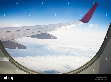 Wing Of An Airplane Flying Above Sky Stock Photo Alamy