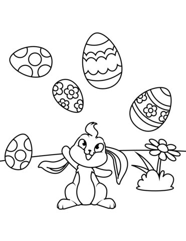 Coloriage Petit lapin jonglant avec des oeufs de Pâques décorés