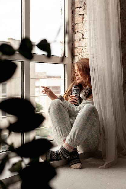 Free Photo Full Shot Girl Looking Out The Window