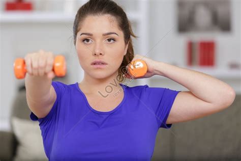 Happy Fitness Girl Working Out With Weights At Home Photo Picture And Hd Photos Free Download