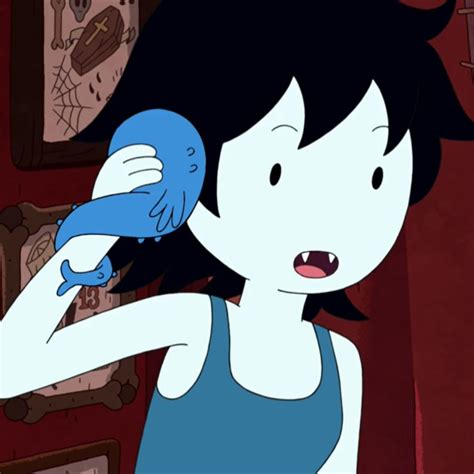 A Woman Holding A Blue Bird In Her Hand