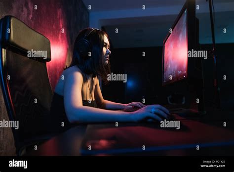 A Cute Female Gamer Girl Sits In A Cozy Room Behind A Computer And Plays Games Woman Live